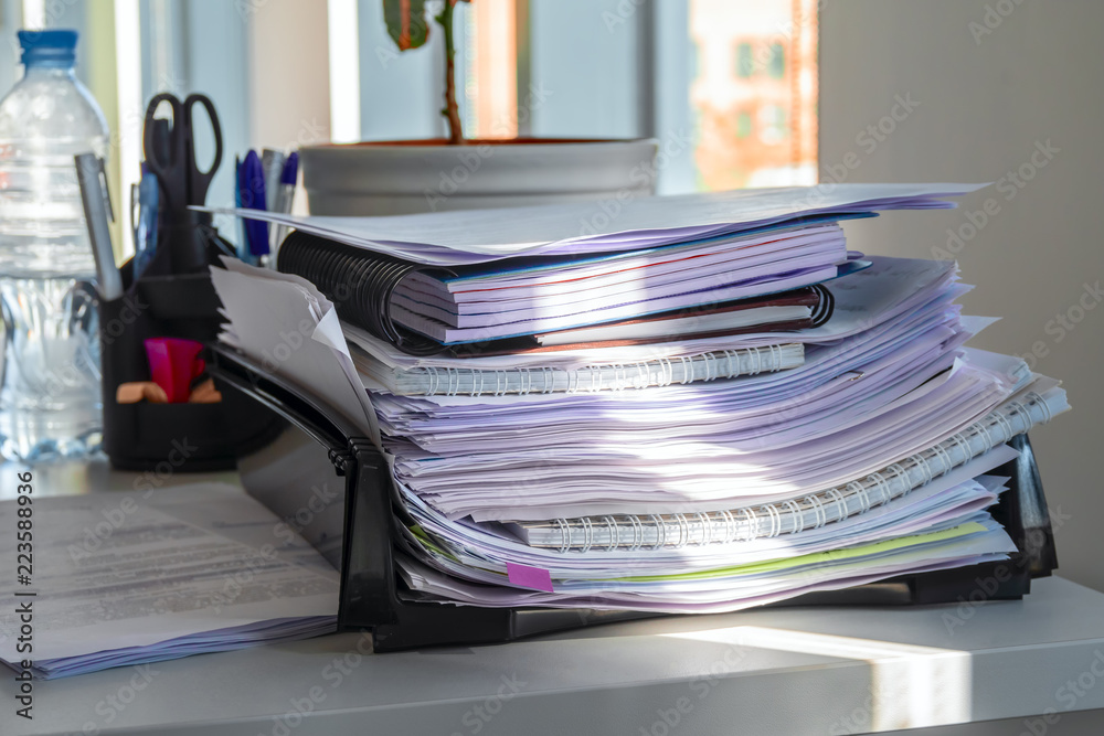 Pile of papers in the office tray. Concept of office clutter and lean ...