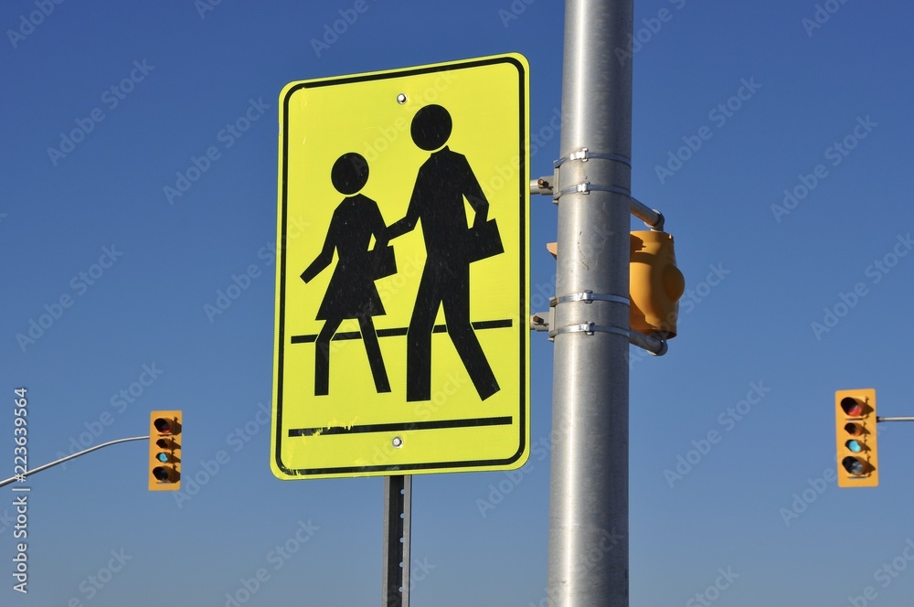 School children crossing sign posted on the intersection Stock Photo ...