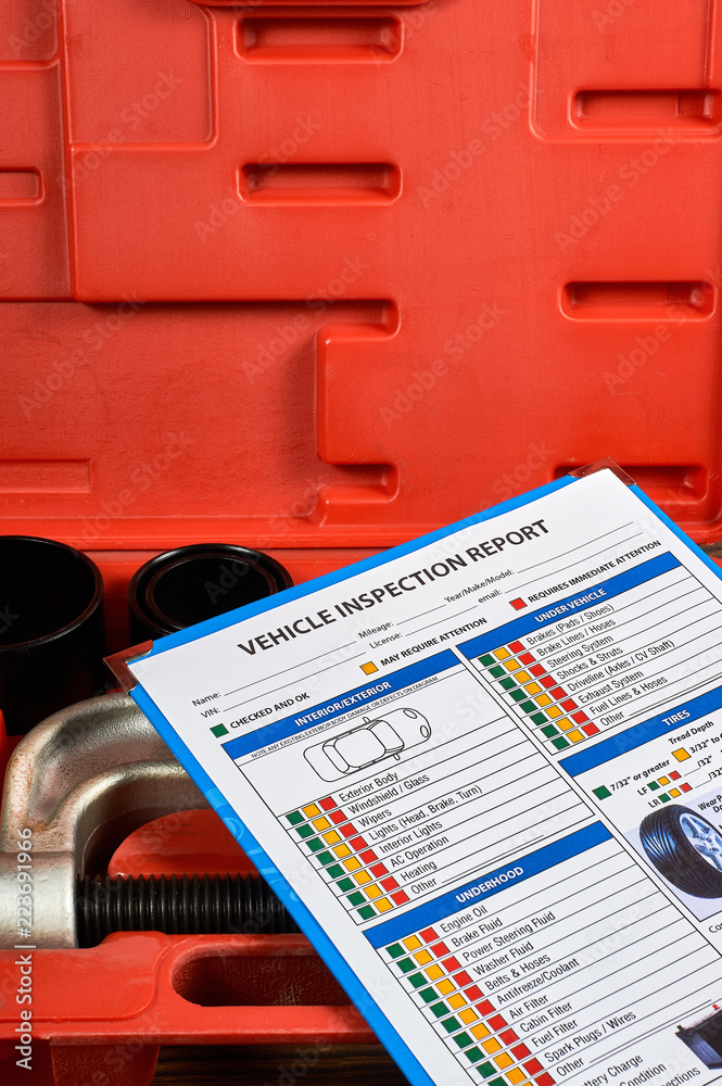 Vehicle vehicle inspection report form against the background of ...