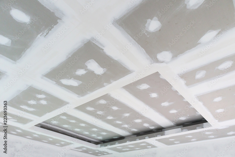 ceiling gypsum board installation at construction site Stock Photo ...