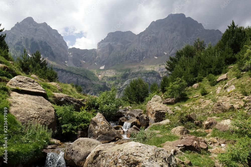 The Piedrafita de Jaca lake and Barranco Cuasta river with the Pena ...