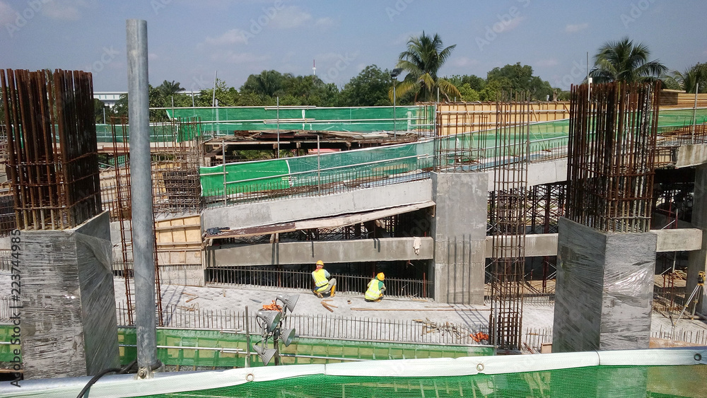 Group of construction workers working at construction site. Building ...