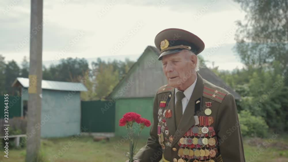 An elderly gray-haired veteran of the great Patriotic war and world war ...