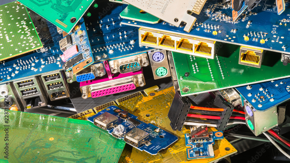 E-waste pile from discarded computer parts. Colorful background from PC ...