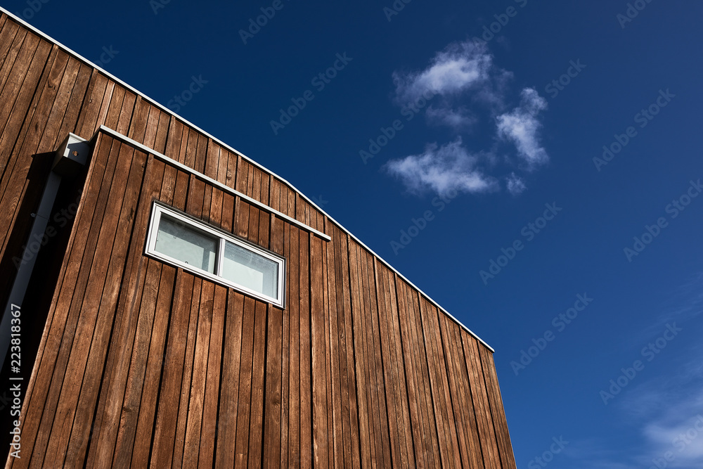 Architectural features of a modern house with wood cladding and a ...