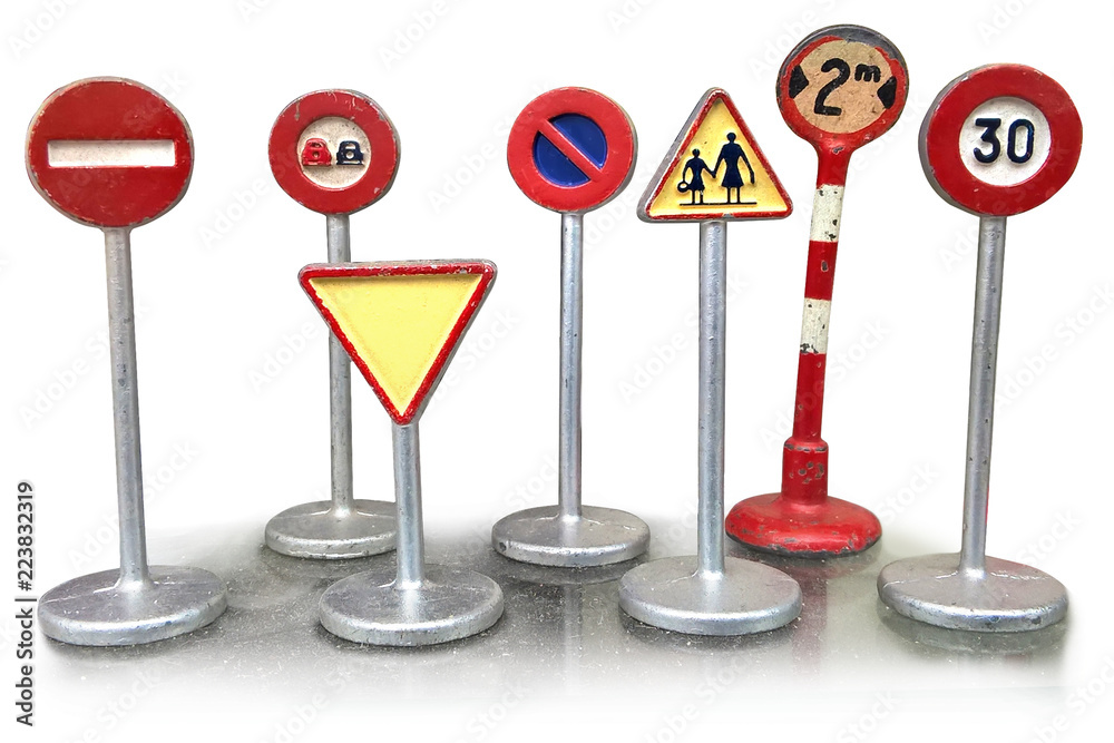 Set of retro toy speed-limit and stop road signs isolated on white ...