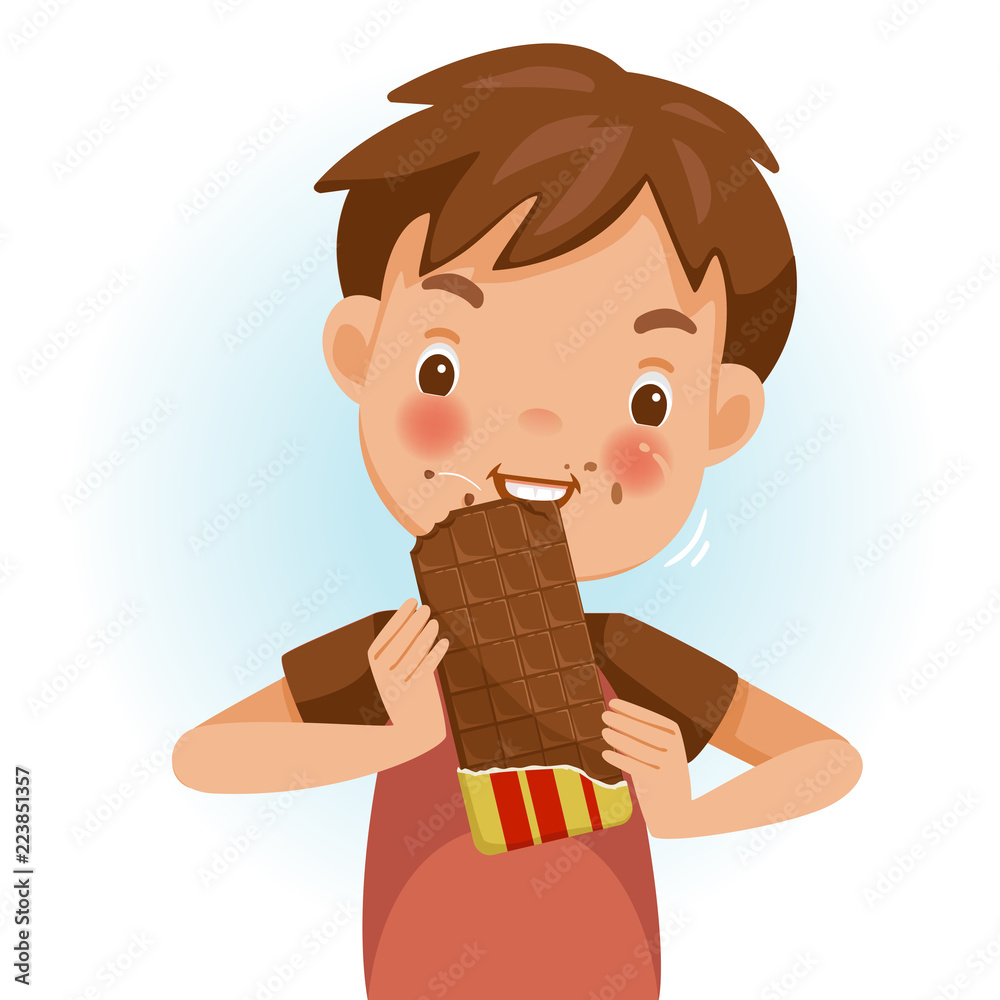Boy eating chocolate. Emotional mood on the child's face feels good ...