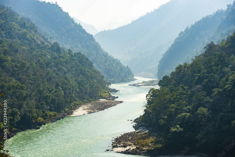 Spectacular view of the sacred Ganges river flowing through the green ...