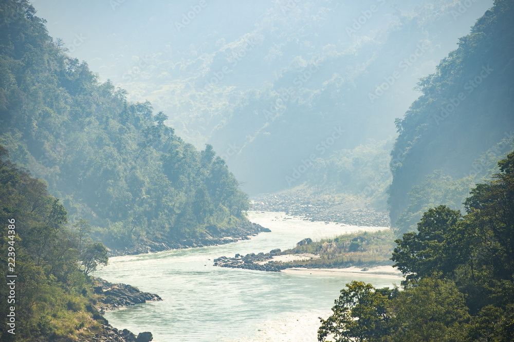 Spectacular view of the sacred Ganges river flowing through the green ...