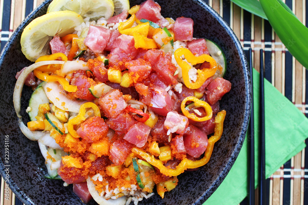 Hawaiian ahi tuna poke bowl served with white rice, vegetables and ...