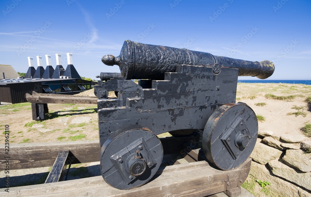 Old rampart with its cannons on the coast of Baltic sea in Svaneke ...