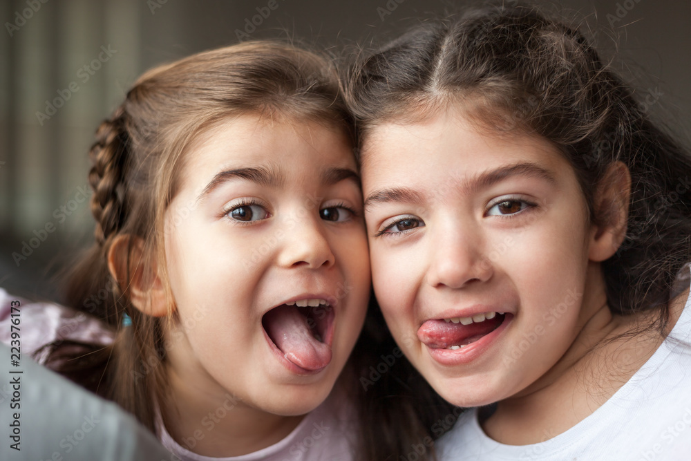 Sisters having fun making silly faces Stock Photo | Adobe Stock