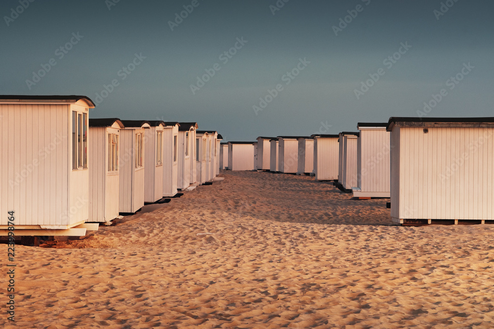 Small cute white beach huts are perfect to spent the summer at the ...