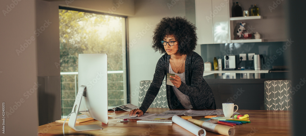 Interior designer with color swatch working on computer Stock Photo ...