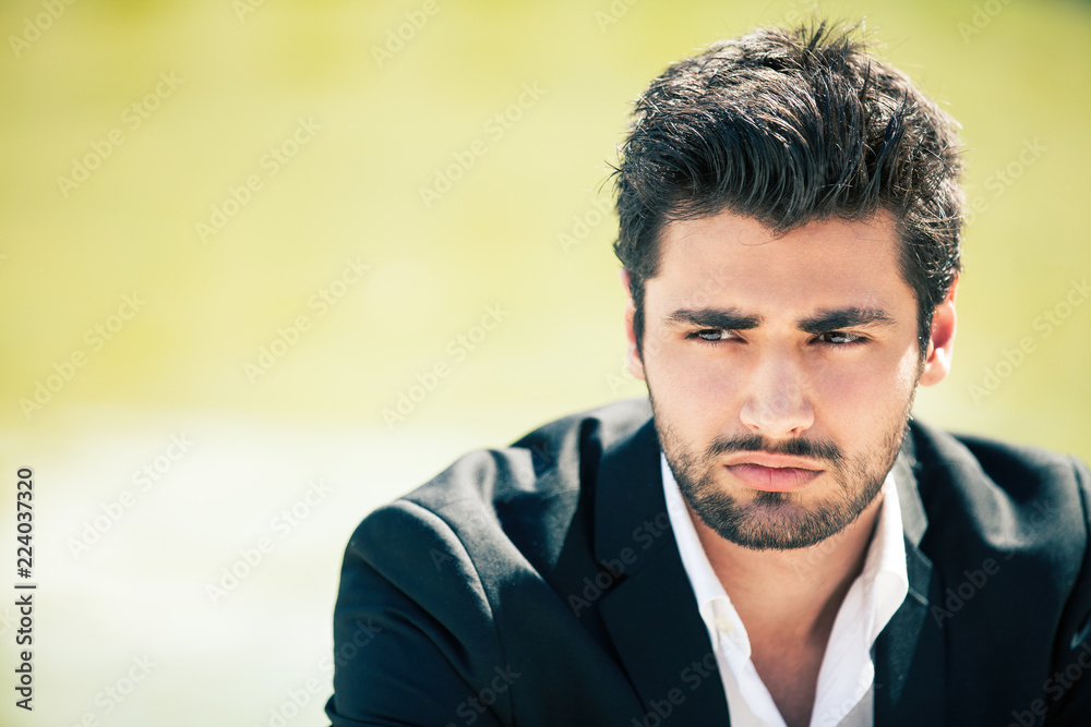 Concern and anxiety. Restless young man. A young handsome boy with dark ...