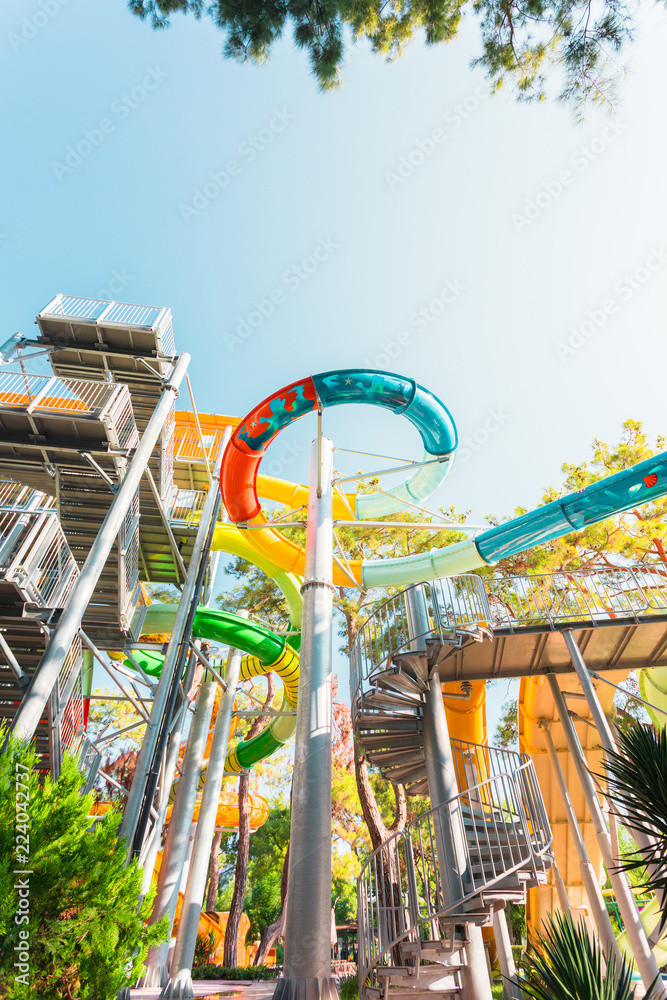 Vicky beautiful multi-colored water slide on the blue sky background ...
