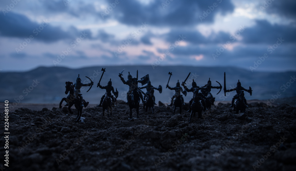 Medieval battle scene with cavalry and infantry. Silhouettes of figures ...