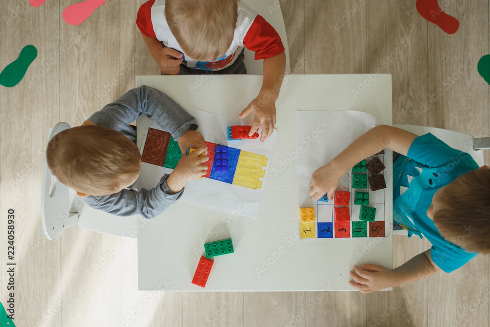 Children playing with blocks in the kindergarten Stock Photo | Adobe Stock