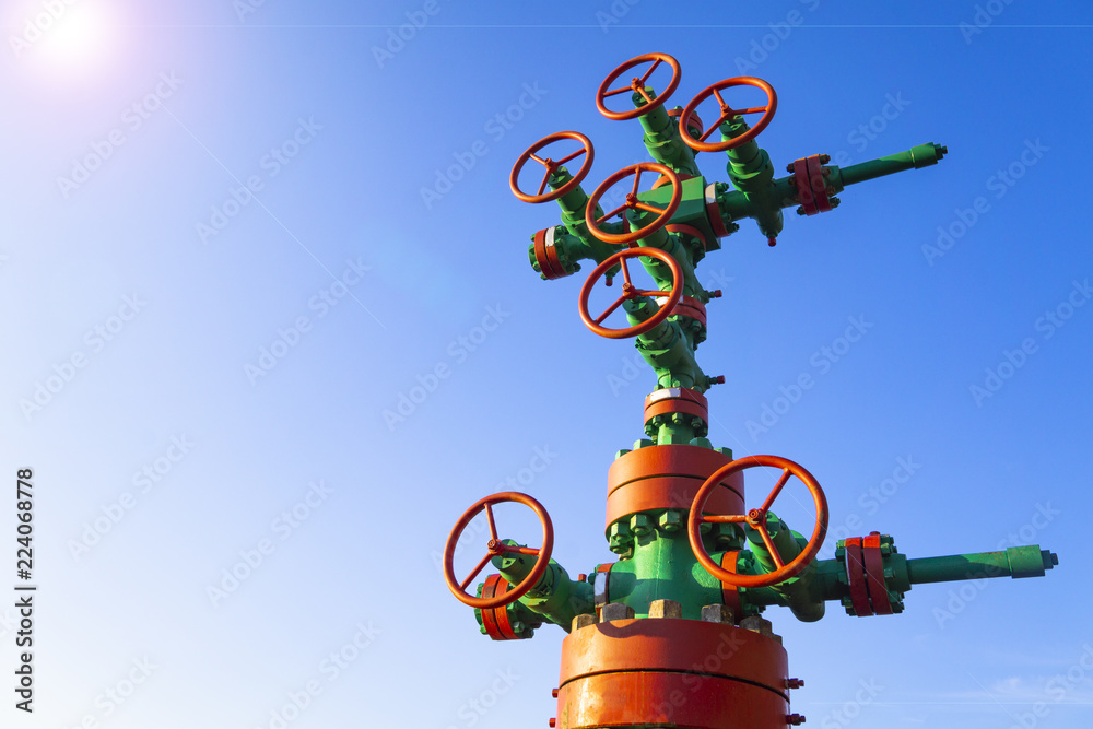Horizontal view of a wellhead with valve armature. Oil and gas industry ...