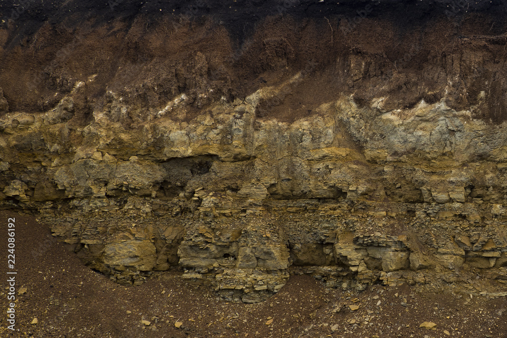 Soil cut-sandstone, stones, clay, sand structure and layers. slice of ...
