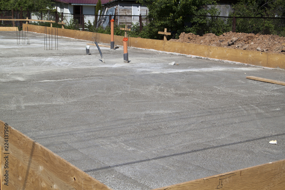 pipes for water supply in the concrete base (slab of foundation) with ...