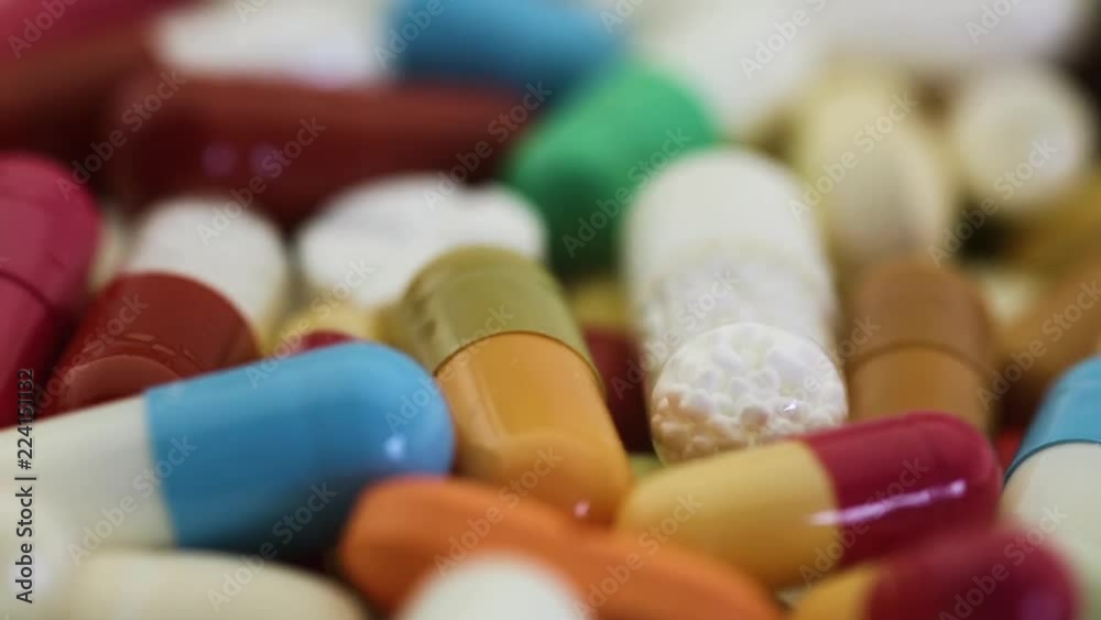 Closeup seamless loop of pills spinning through view Stock ビデオ | Adobe ...