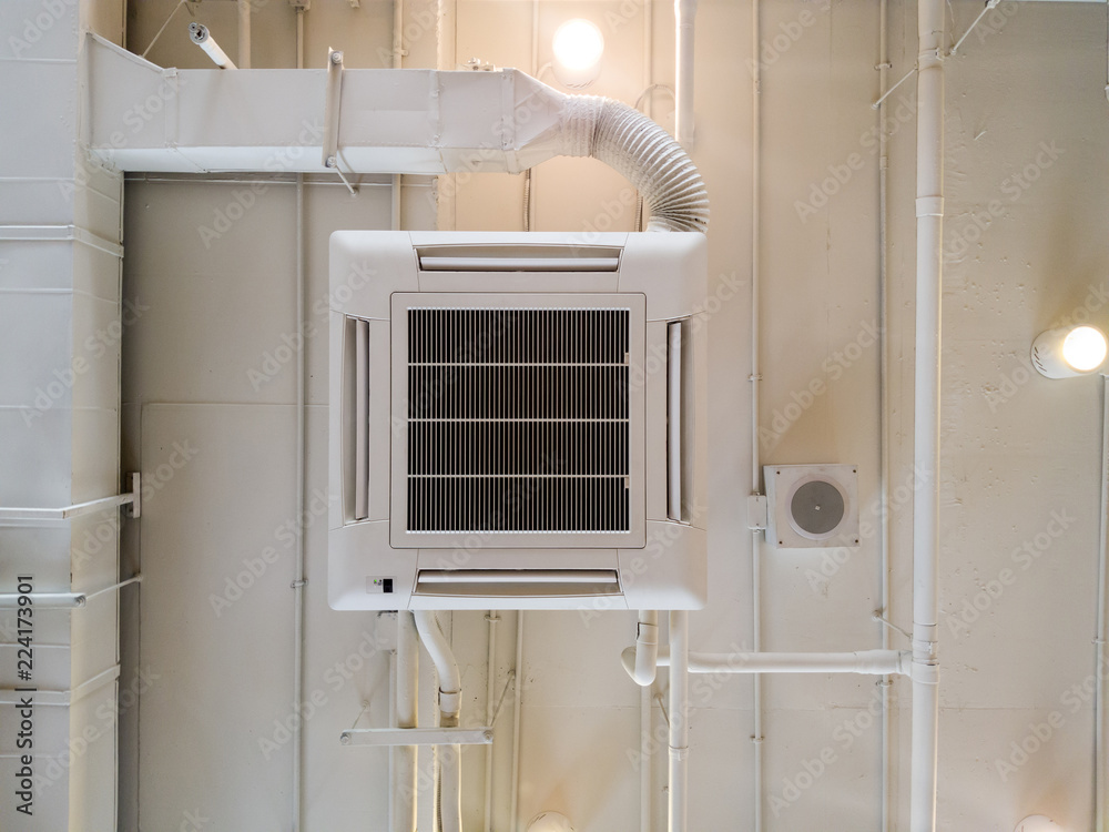 White Industrial air conditioner cooling pipe with plumbing at ceiling ...