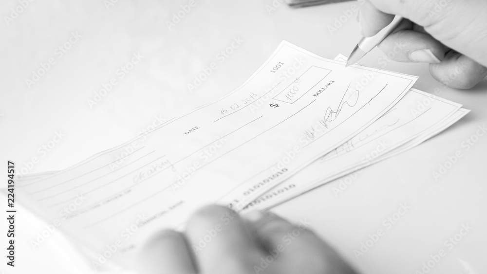 Black and white image of woman writing payment bank cheque Stock Photo ...
