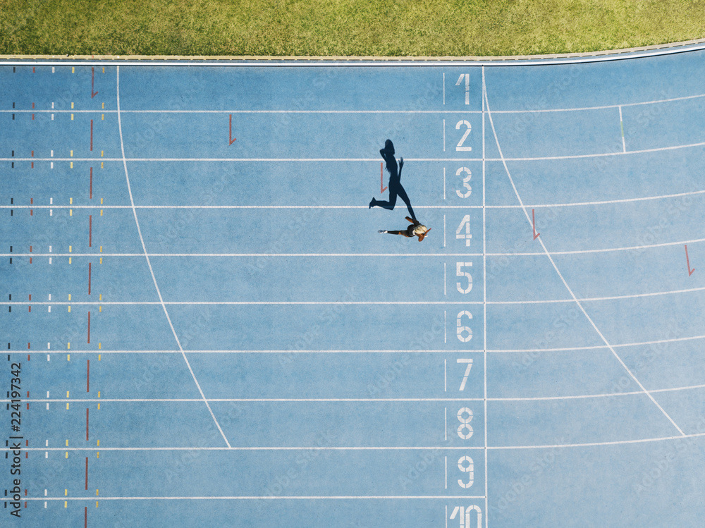 Track and field track with sprinter in overhead shot Stock Photo ...