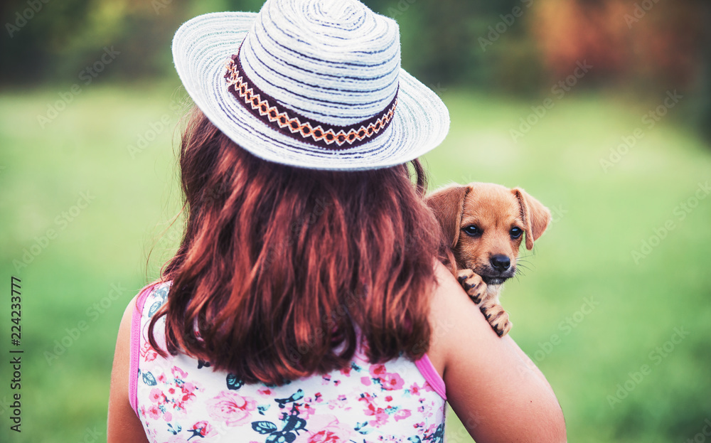 Childhood time. Little girl with a dog. Lifestyle, pets and animals ...