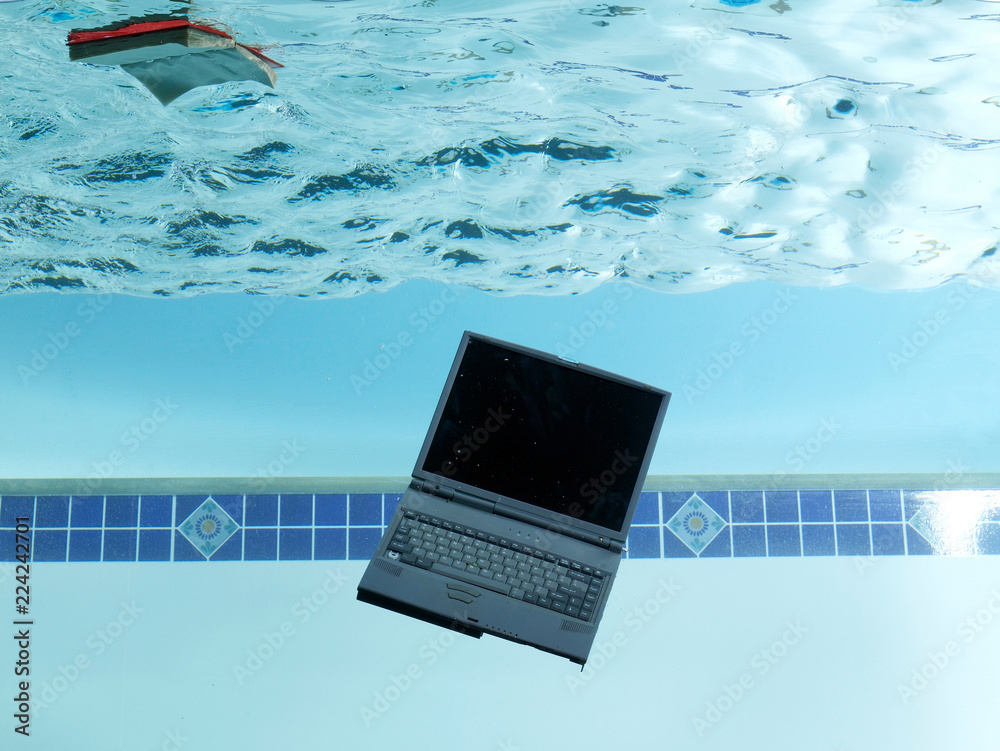Laptop in swimming pool Stock Photo | Adobe Stock