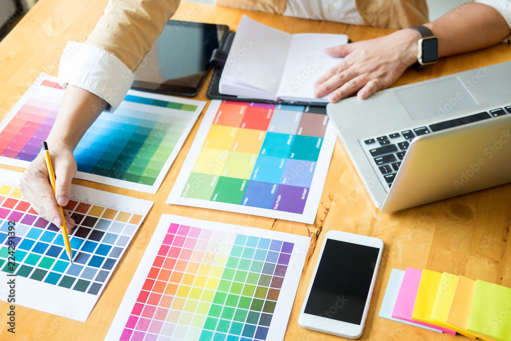 Creative Graphic designer at work. Color swatch samples pantone palette ...