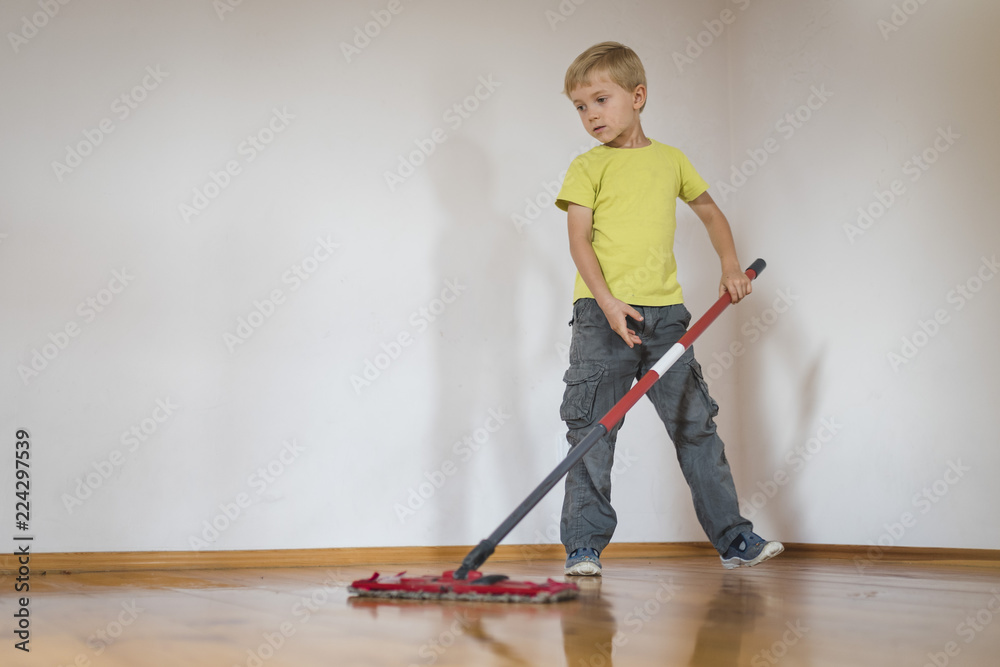 Kid Mopping The Floor