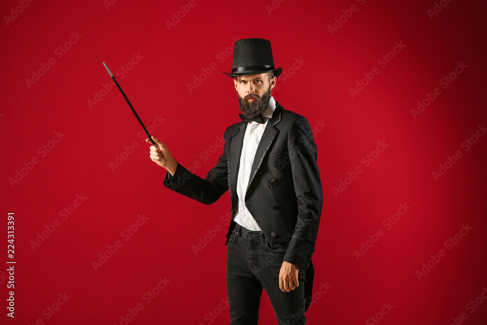 Male magician on color background Stock Photo | Adobe Stock