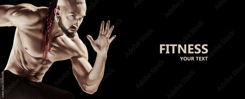 The fit man doing weight lifting in gym on black background. The ...
