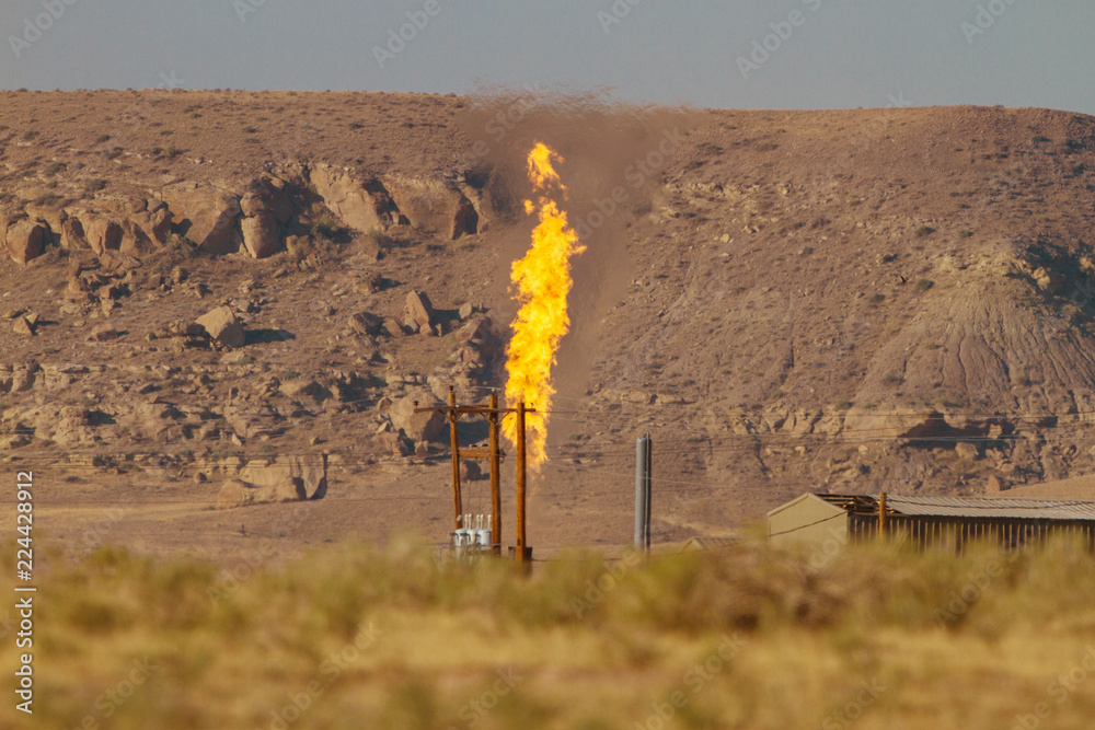 Methane burning at a flare stack in rural America adds a harmful ...