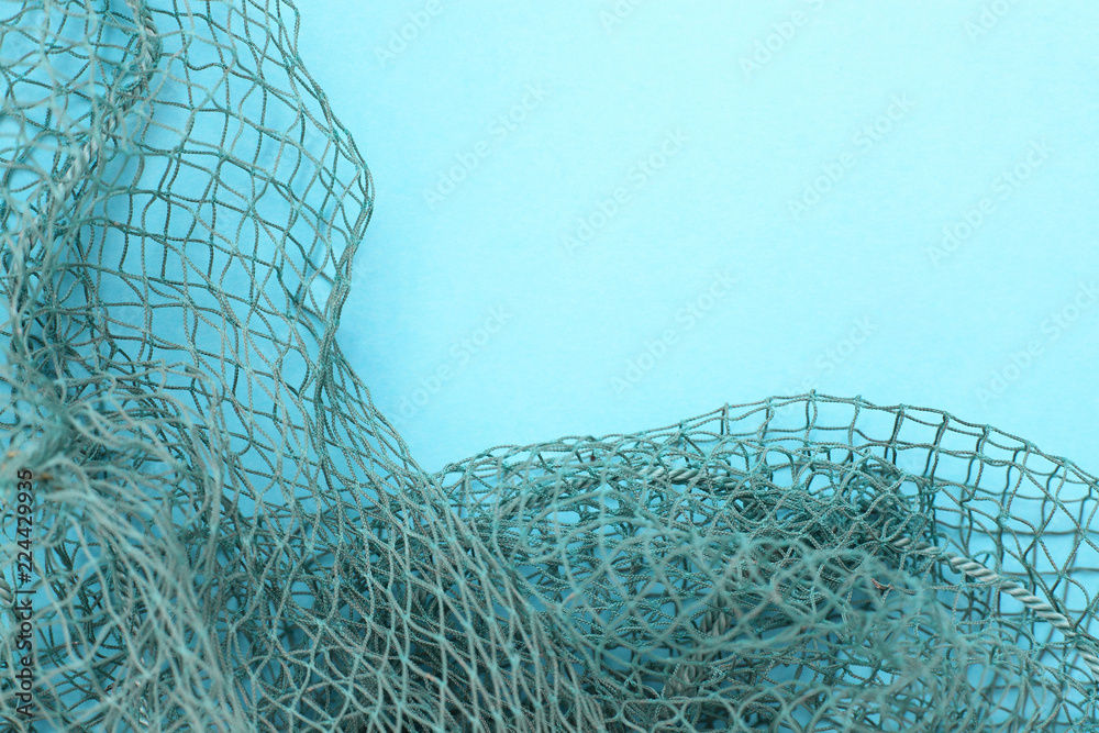 Fishing net with space for your text. Blue background for a fishery ...