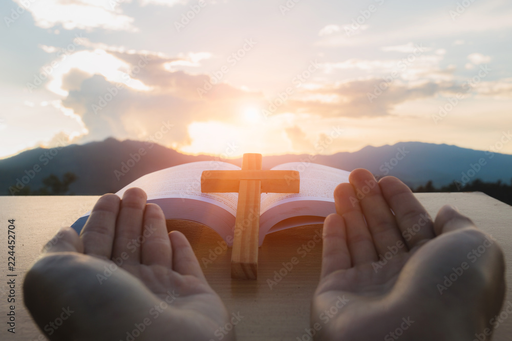 Human hands open palm up worship, open Bible, script in blur with focus ...