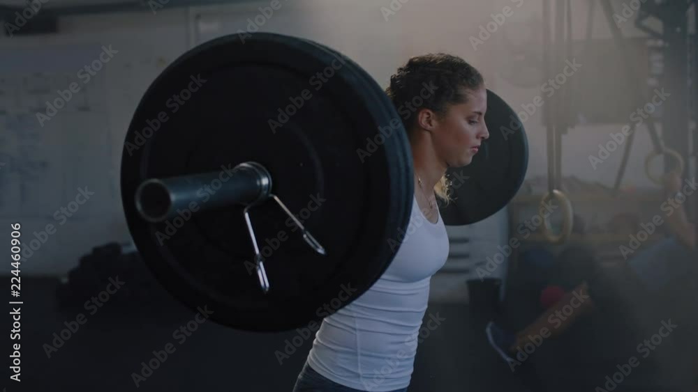 healthy woman bodybuilder workout using barbell weightlifting exercise ...