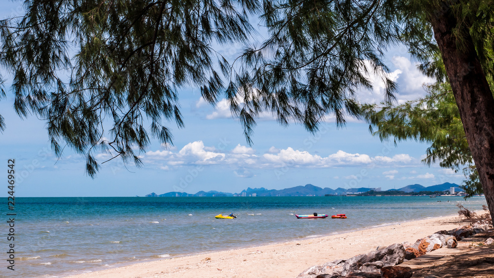 Beautiful Cha-am beach with blue sky and pine trees. Stock Photo ...