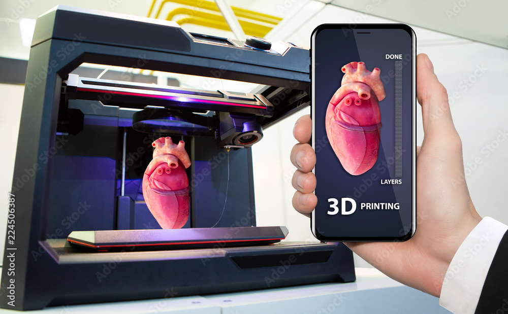 Hand with phone. Application for printing human organs in a 3D printer ...