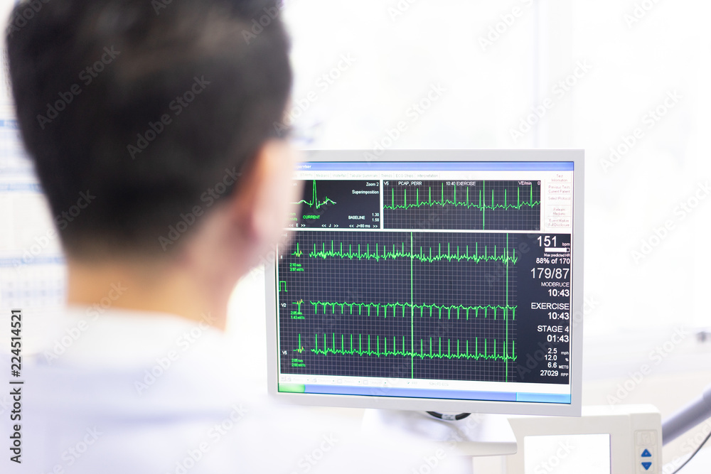 The doctor check heart rate and pulse of patient by running test for ...