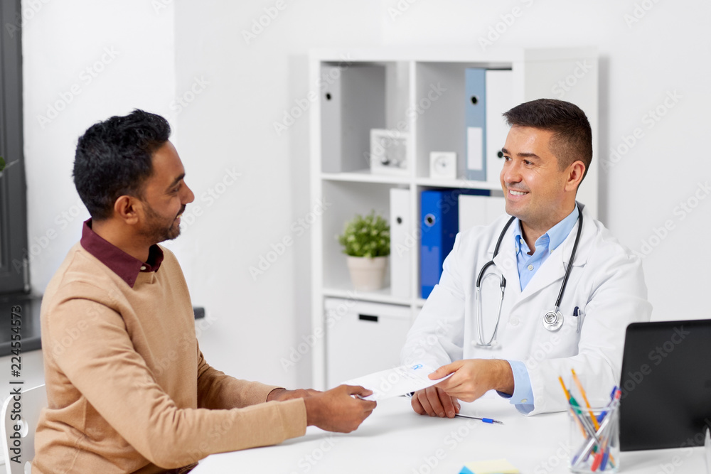 medicine, healthcare and people concept - doctor giving prescription to ...