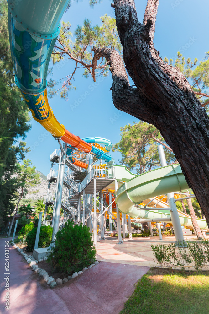 Vicky beautiful multi-colored water slide on the blue sky background ...