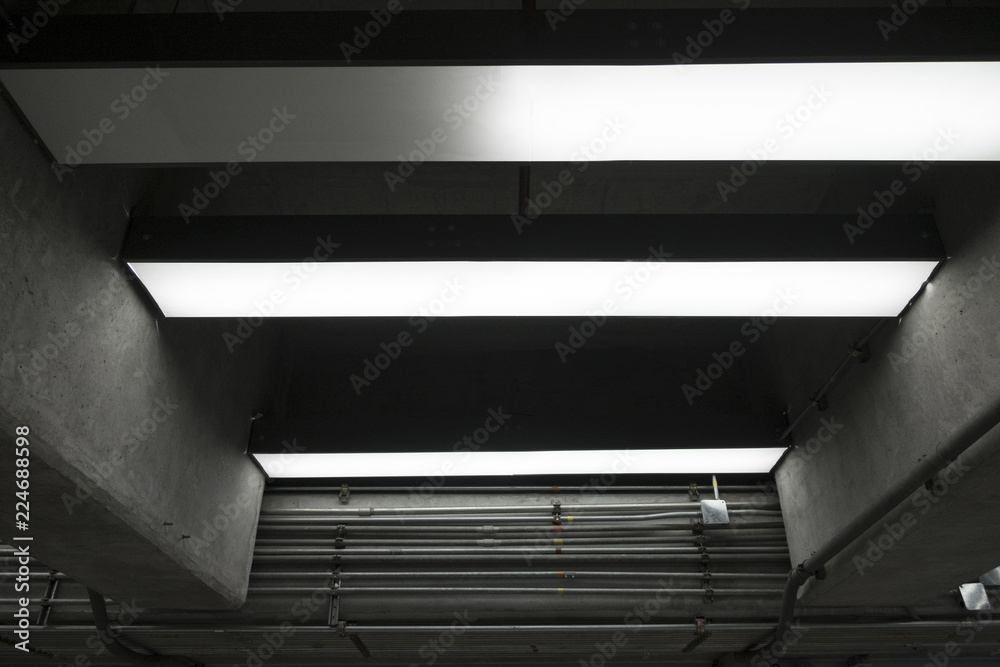 Background and texture of light on ceiling. Cables in steel tube on ...