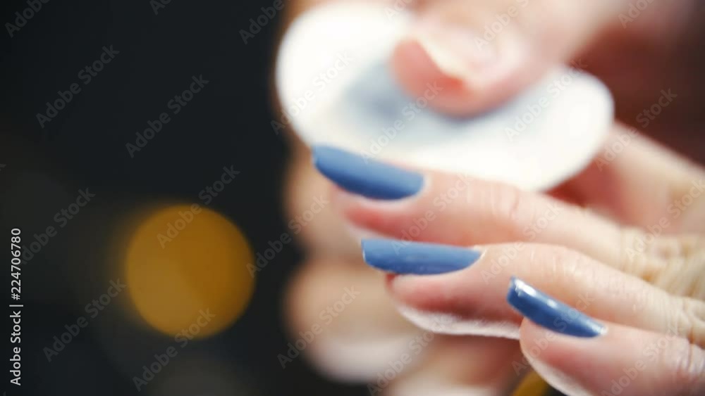 Removing blue color from fingernails close-up 4K. Long shot of person's ...