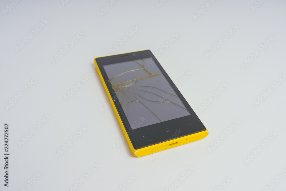 Broken mobile phone screen, scattered shards. Smartphone monitor damage ...