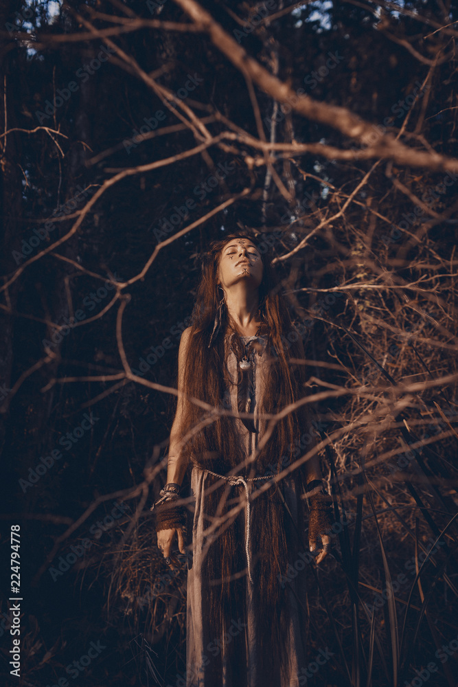 Beautiful young woman model with very long hair. witch craft concept ...