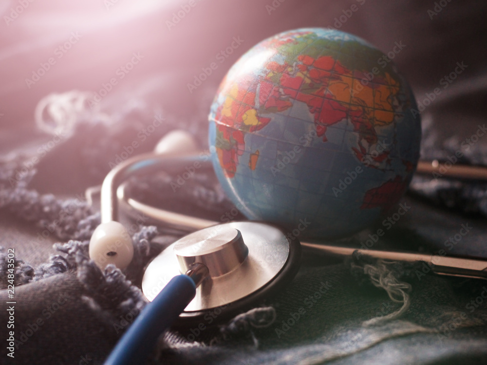 Globe model of the earth and stethoscope Stock Photo | Adobe Stock