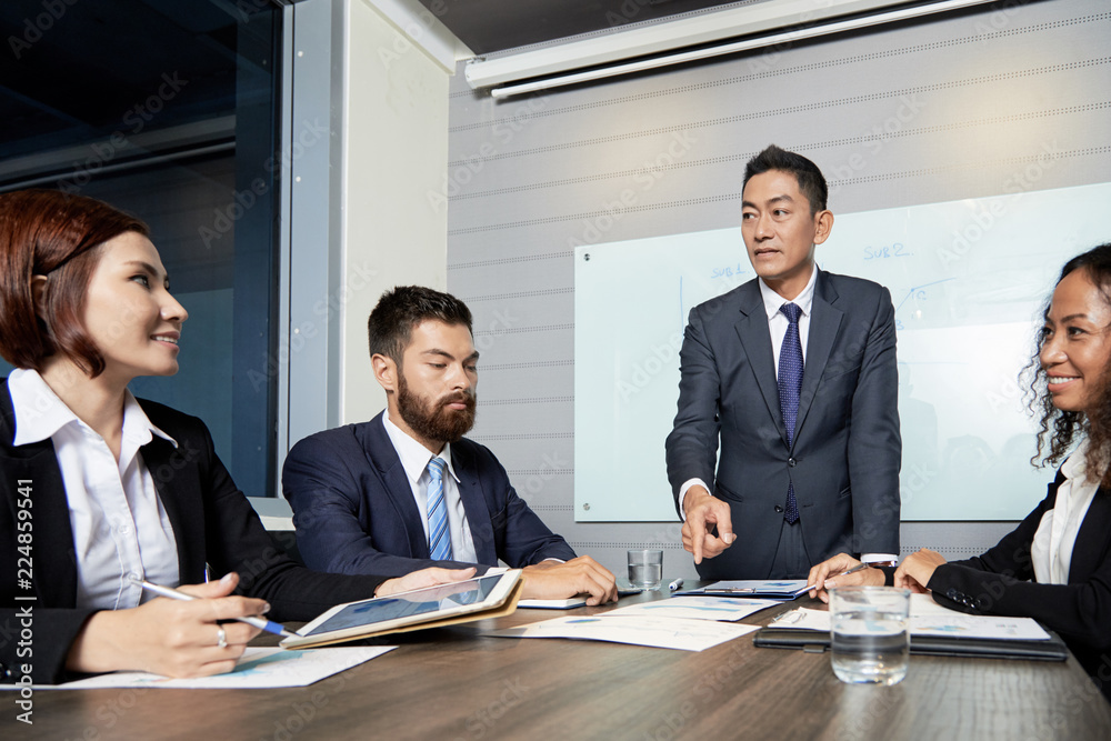 Group of multiethnic coworkers having business meeting in conference ...